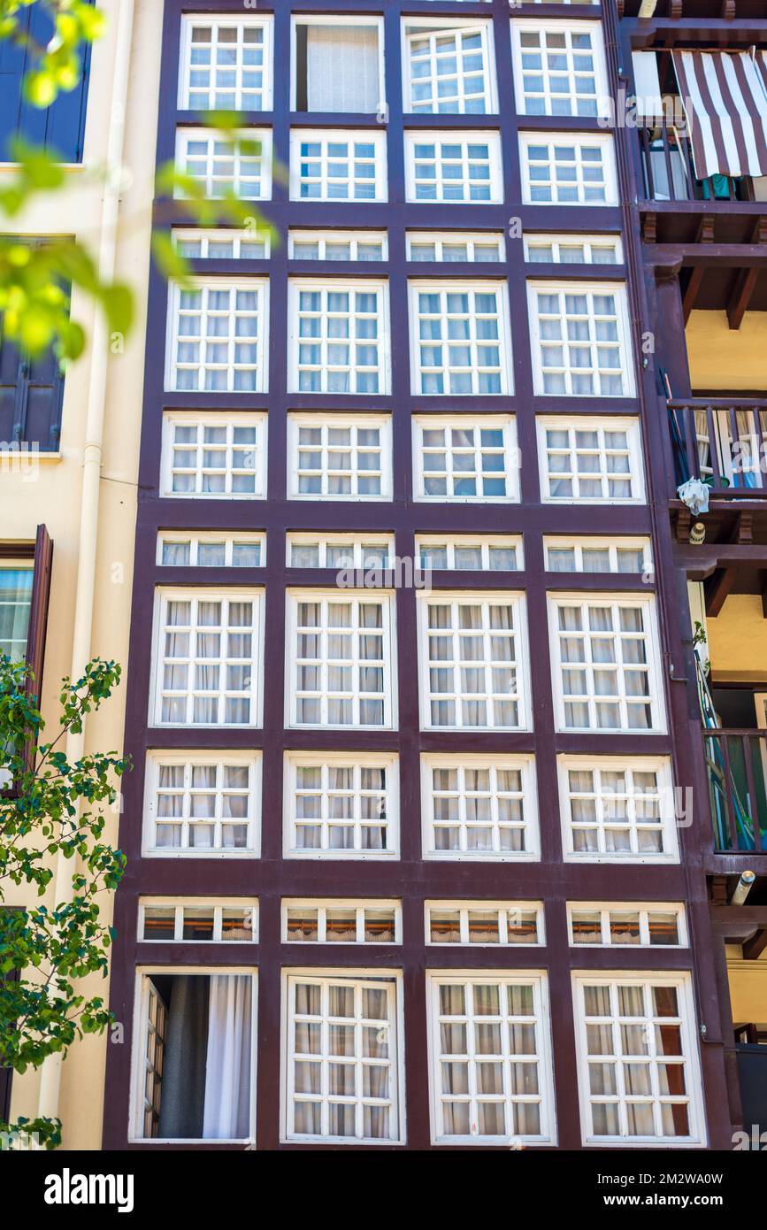 View of a house front with many windows Stock Photo - Alamy