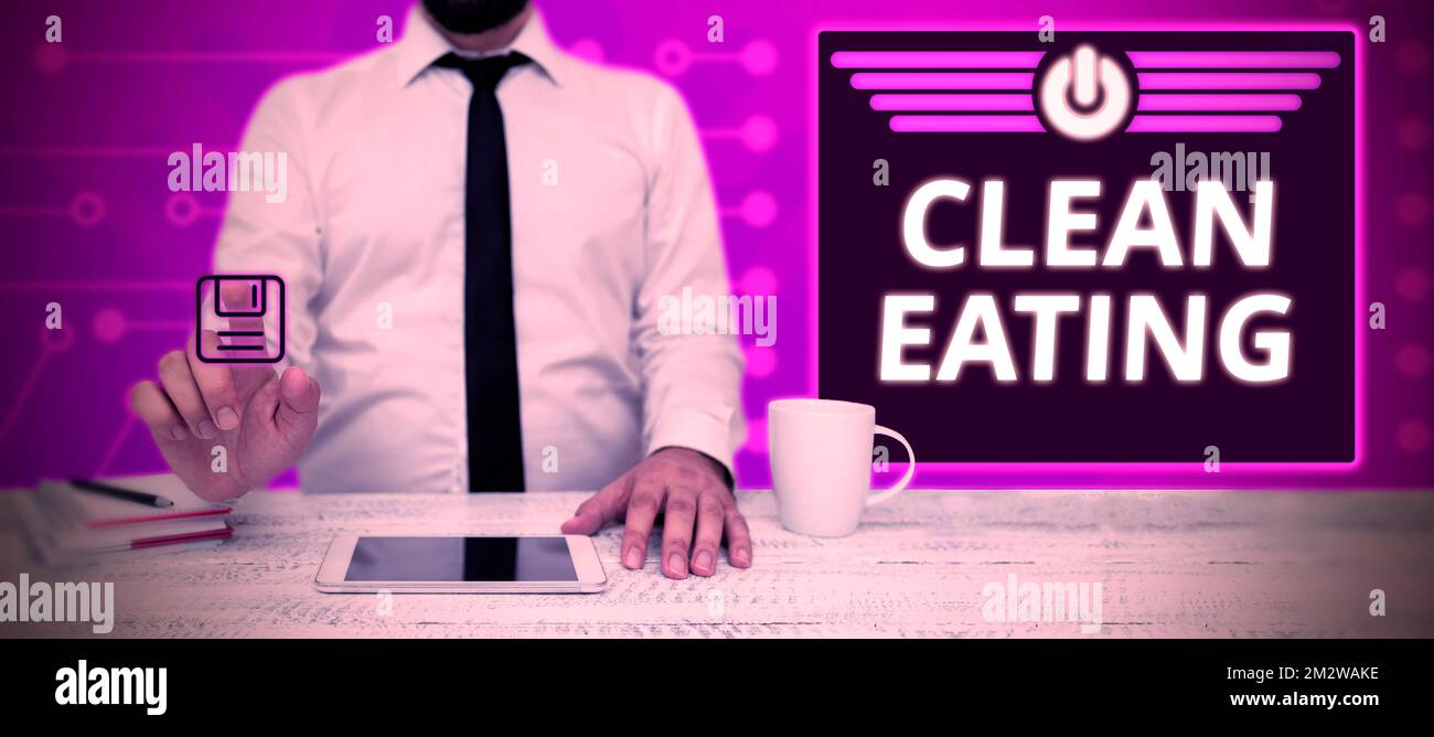 Hand writing sign Clean Eating. Business idea Practice of eating only ...