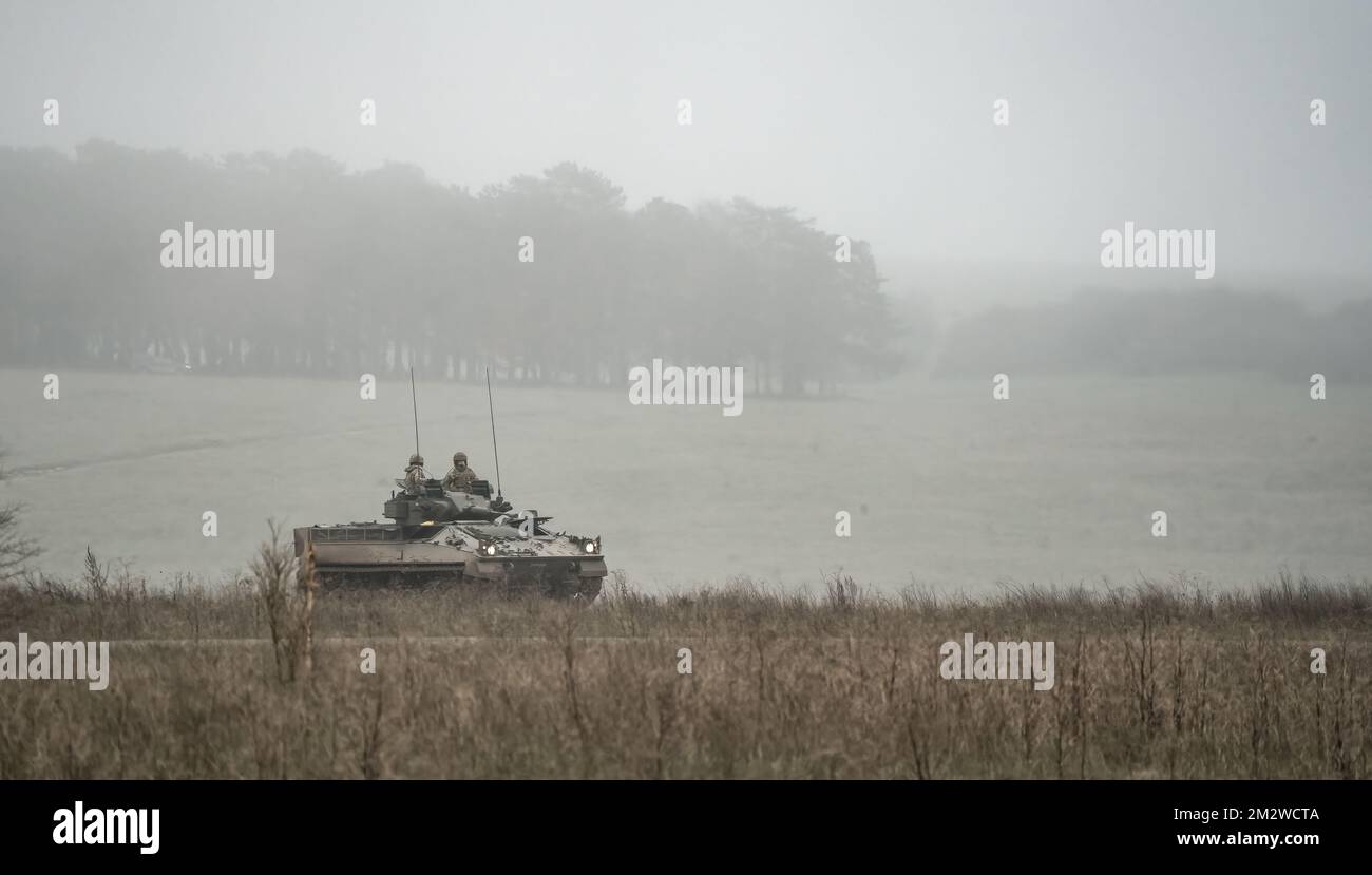 british army Warrior FV510 tank in motion on a military combat exercise ...