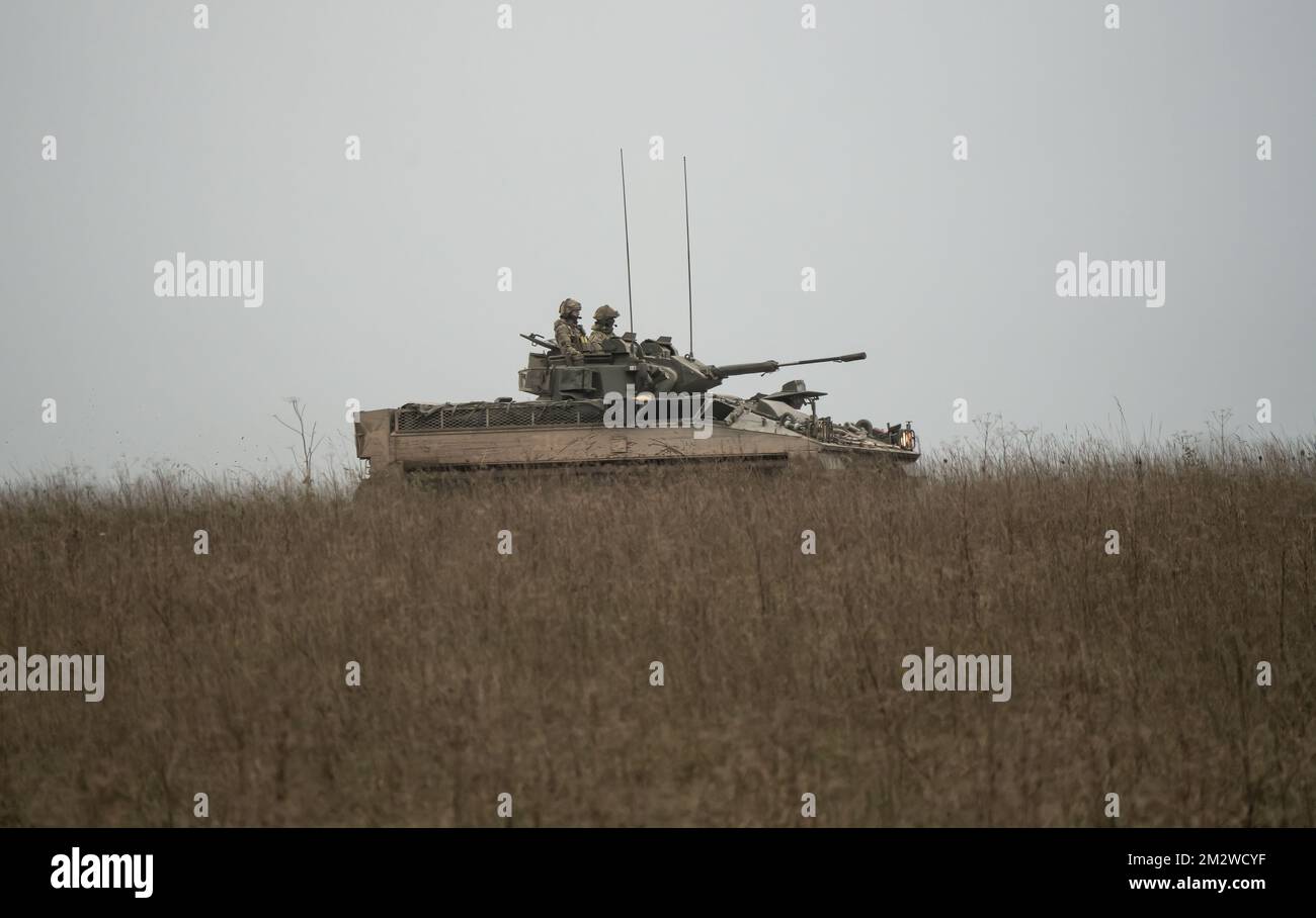 british army Warrior FV510 tank in motion on a military combat exercise ...
