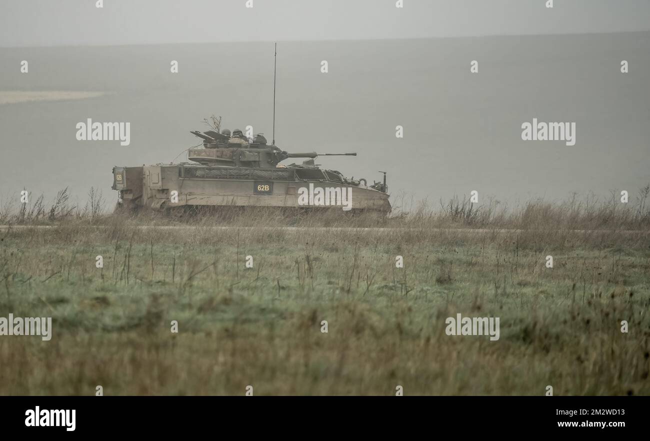 british army Warrior FV510 tank in motion on a military combat exercise ...
