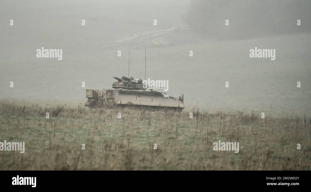 british army Warrior FV510 tank in motion on a military combat exercise ...