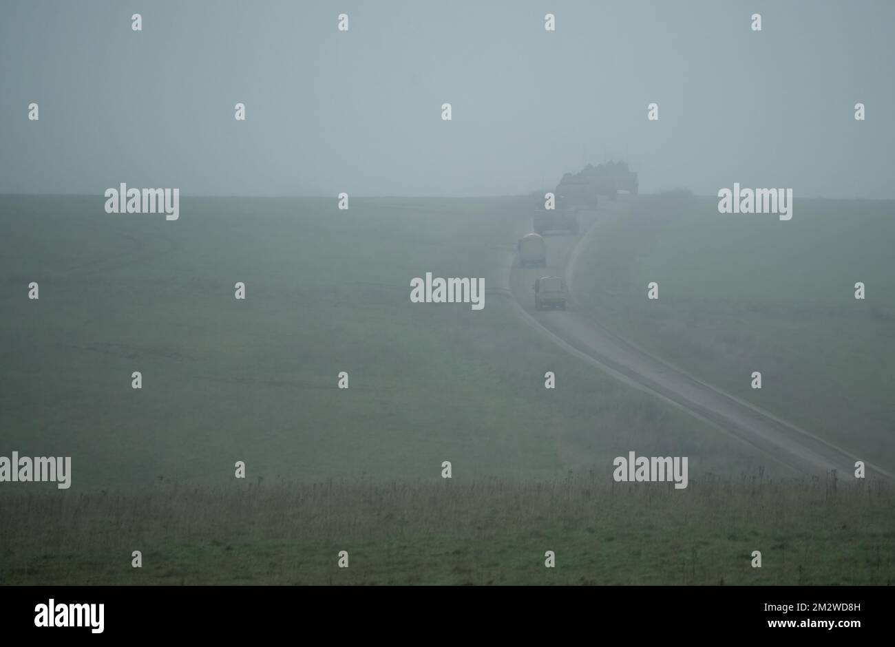 british army Challenger 2 ii FV4034 main battle tanks through fog on a ...