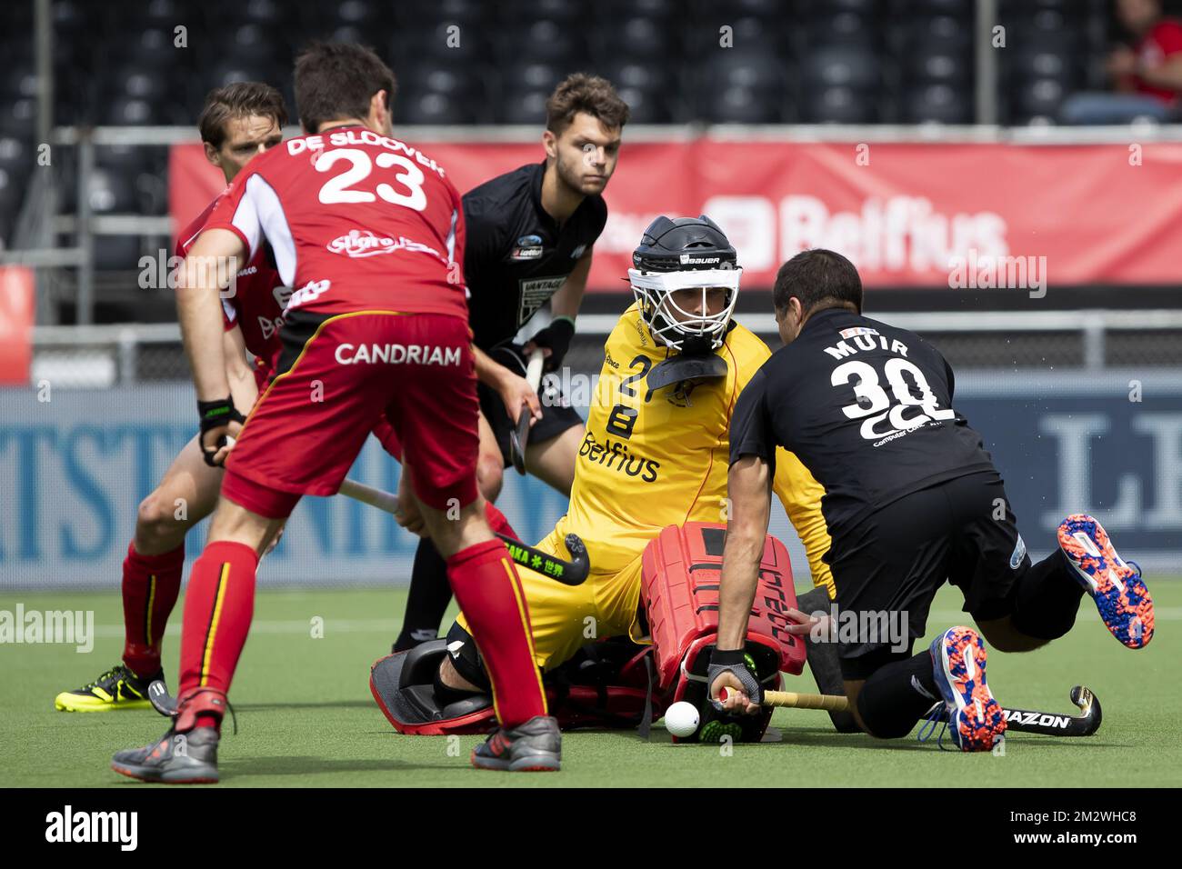 Belgium's goalkeeper Vincent Vanasch and New Zealand's George Muir ...