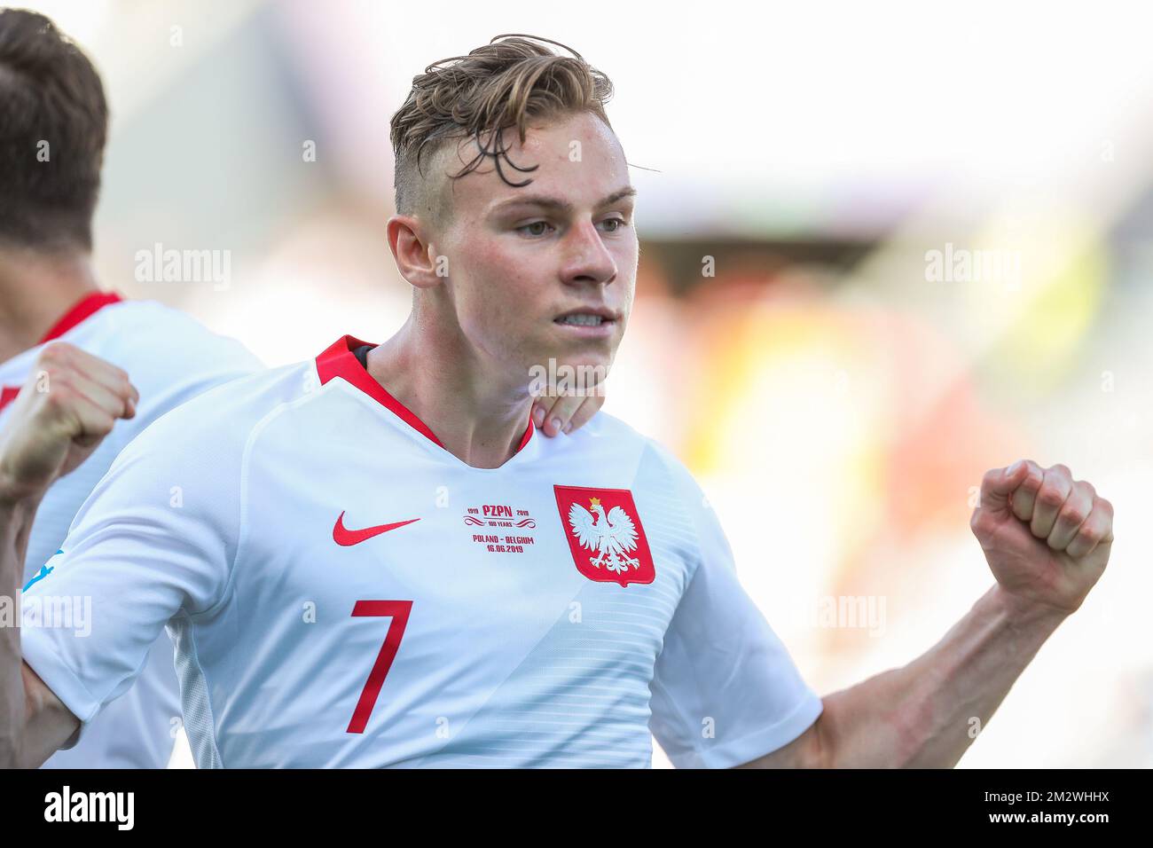 Poland's Szymon Zurkowski celebrates after scoring during a game ...