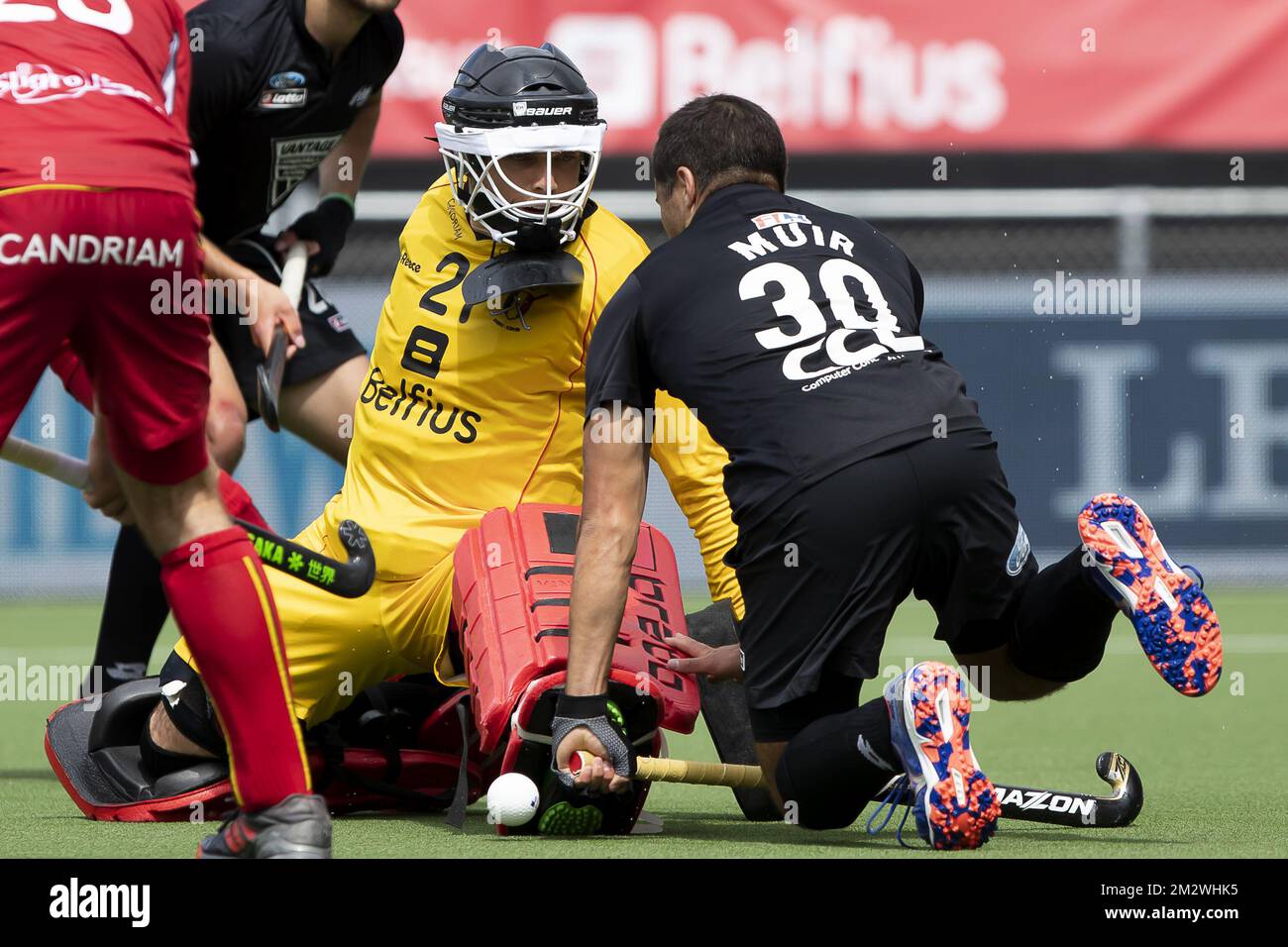 Belgium's goalkeeper Vincent Vanasch and New Zealand's George Muir ...
