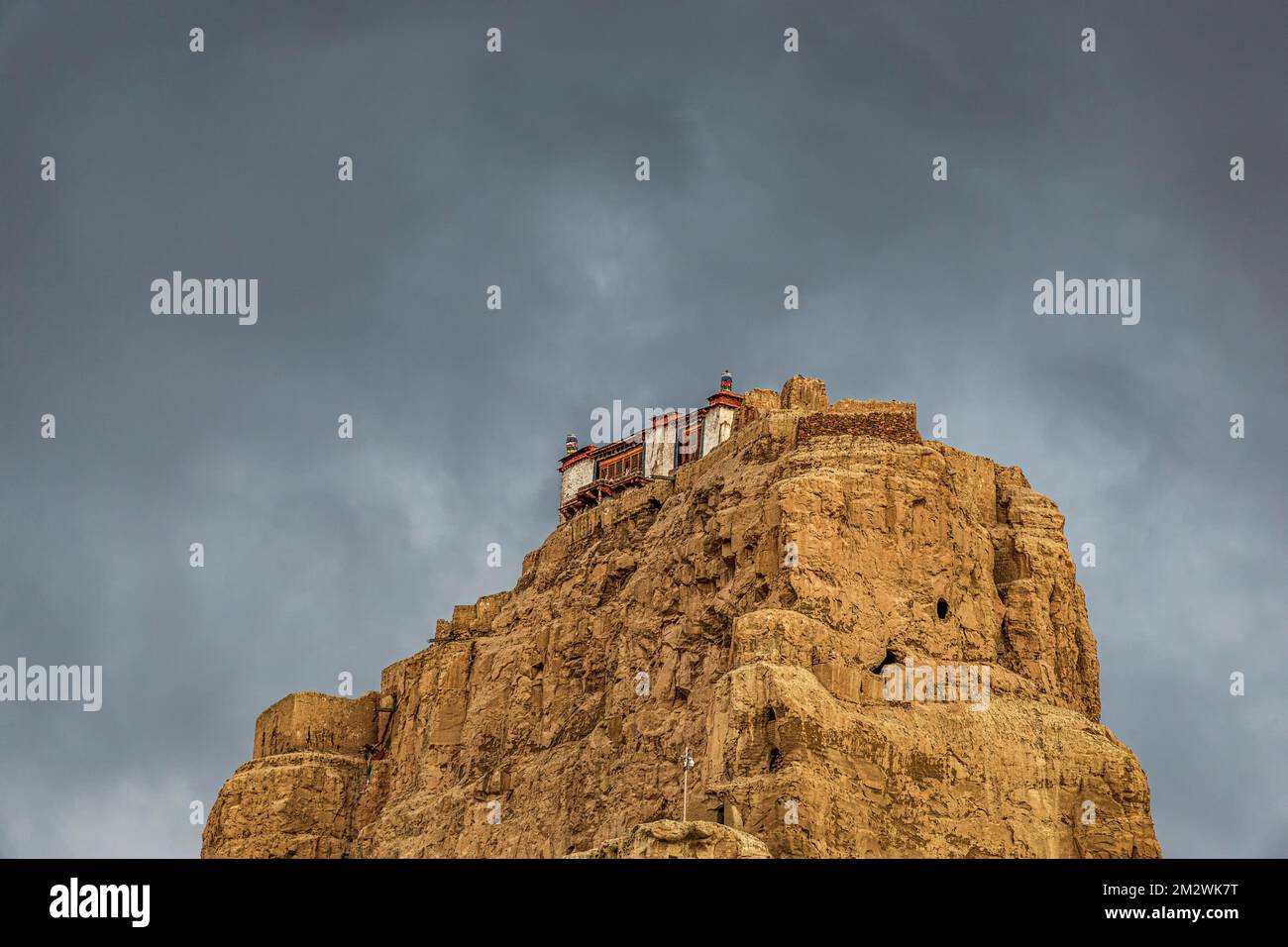 The ruins of the historic Guge Kingdom with ancient buildings on a rock ...