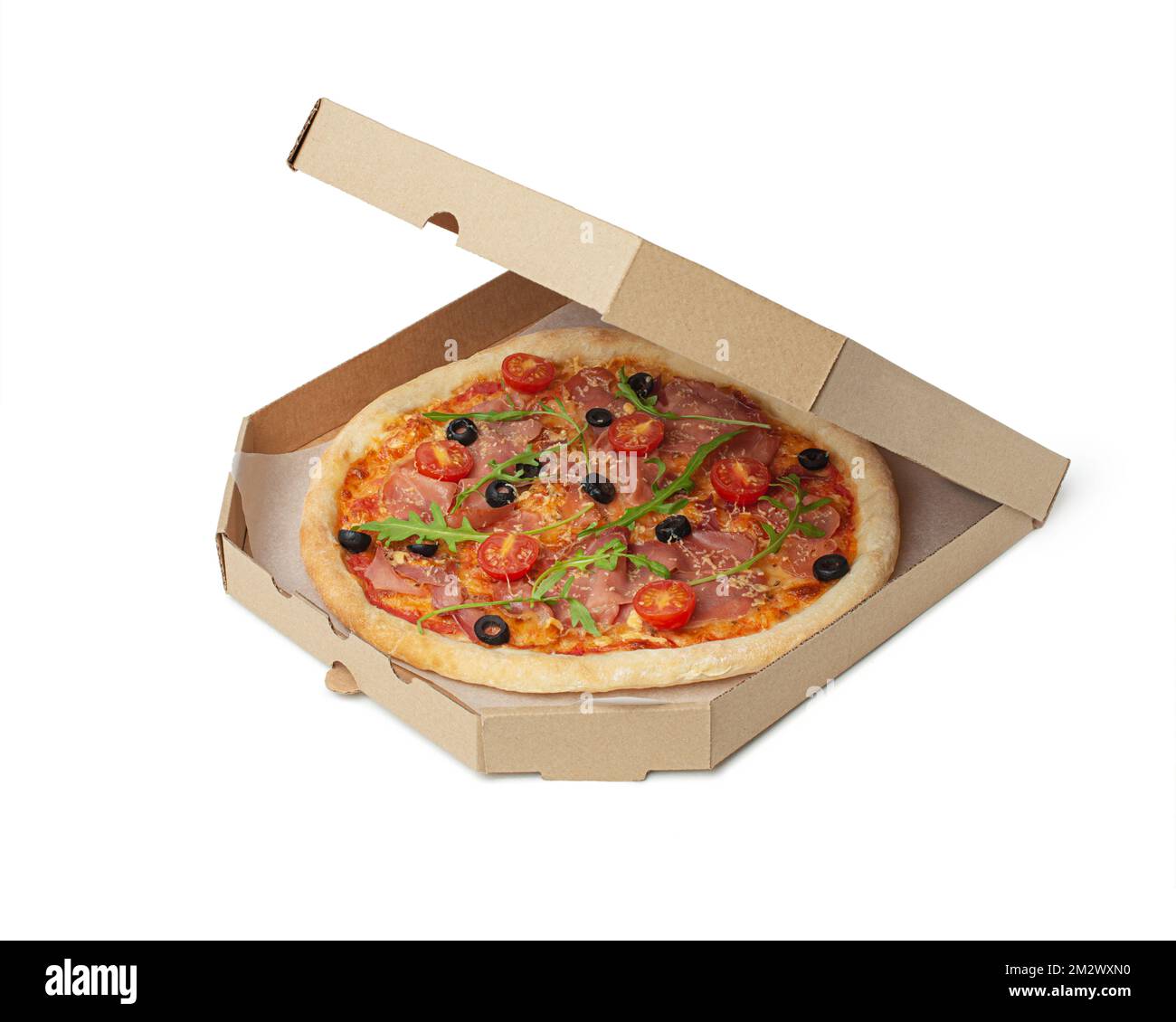 Pizza with prosciutto, tomatoes and cheese in a box on a white ...