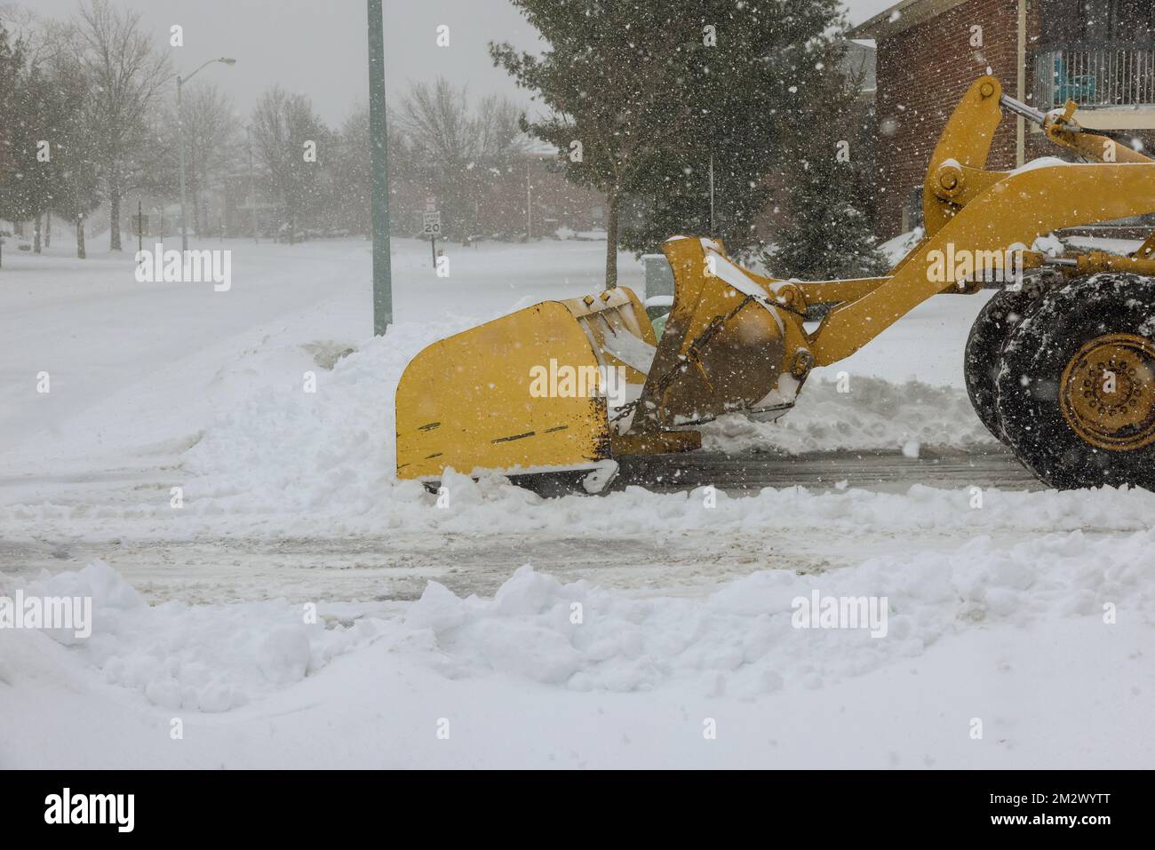Clearing parking lot and road of snow with truck and moving it to edge ...