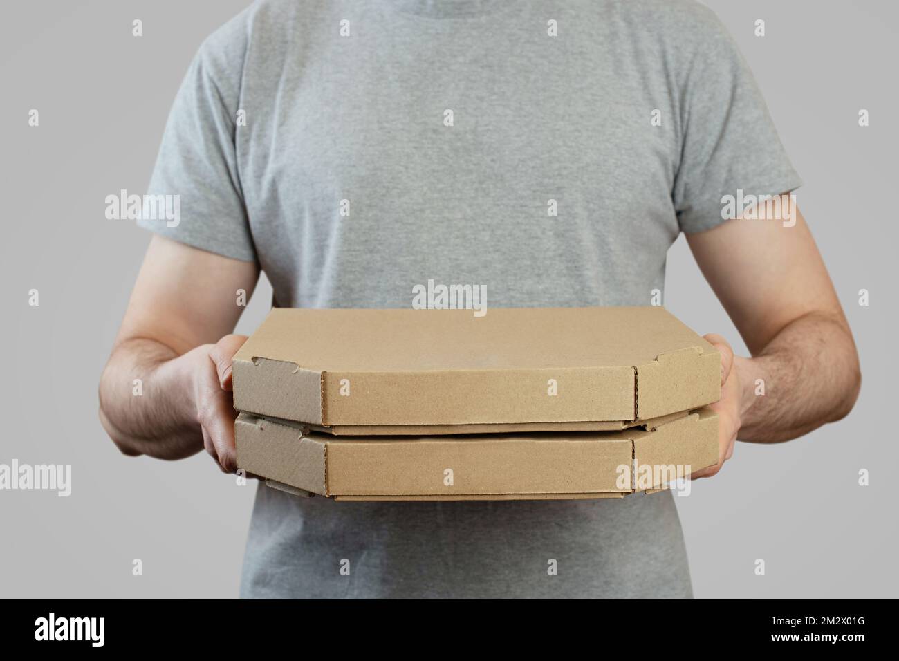 A man with pizza boxes in his hands. Pizza delivery Stock Photo - Alamy
