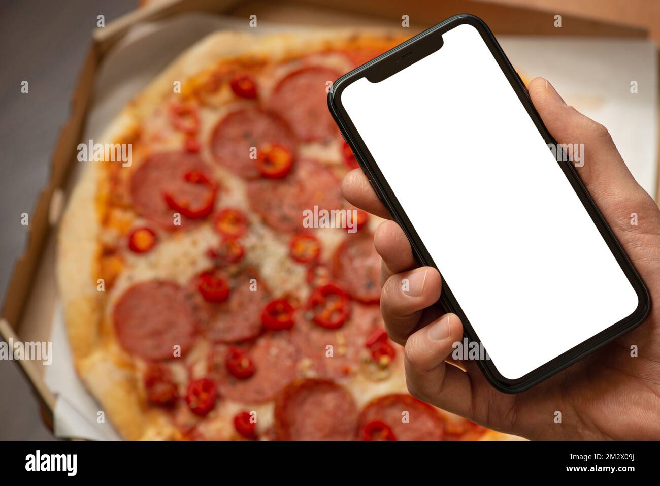 Pizza delivery man holding phone hi-res stock photography and images ...