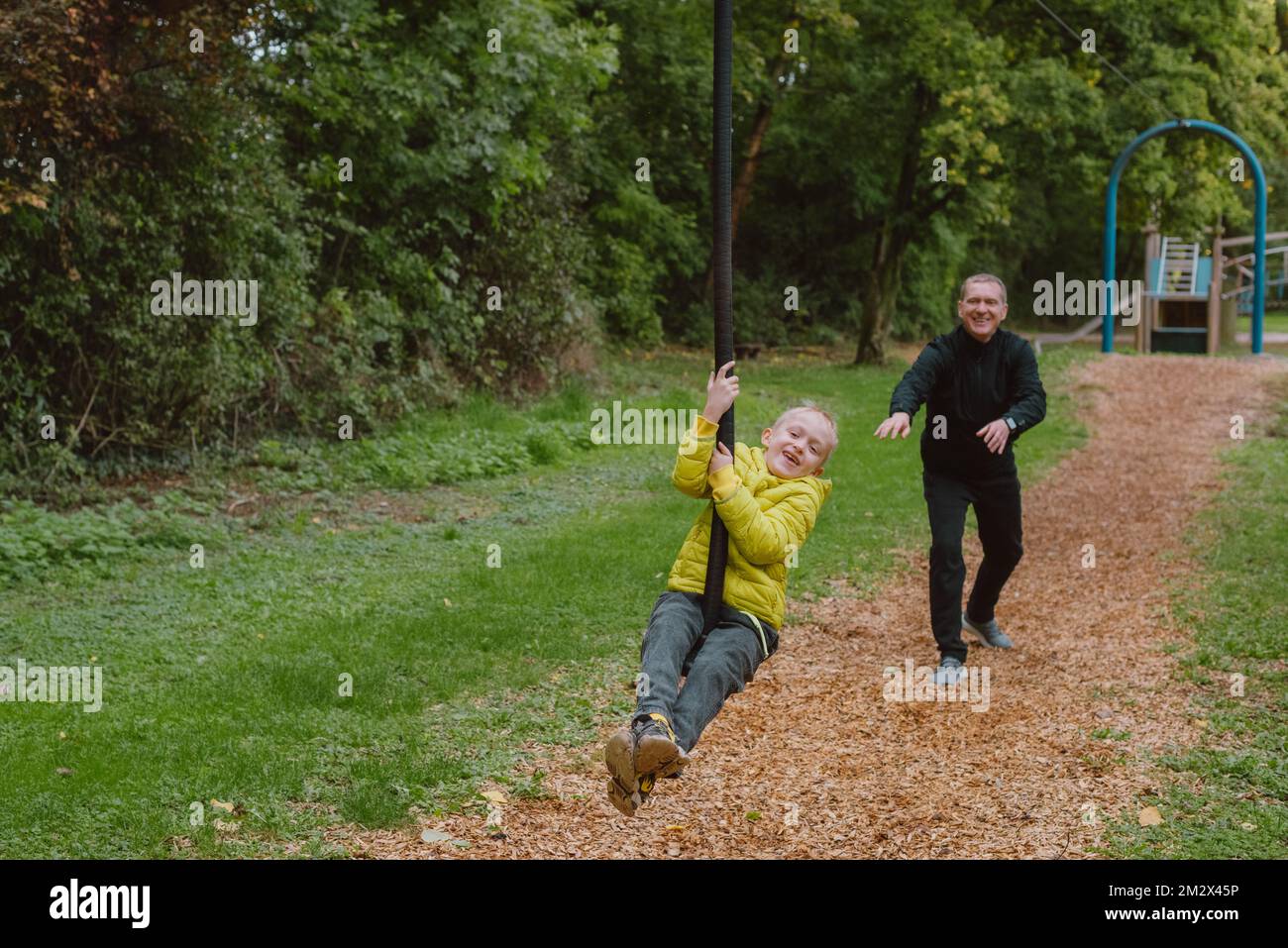 Kid Bungee jumping in the Autumn Forest Stock Photo - Alamy