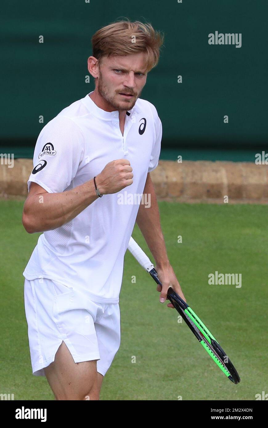 Belgian David Goffin reacts as he wins the first set in the game ...