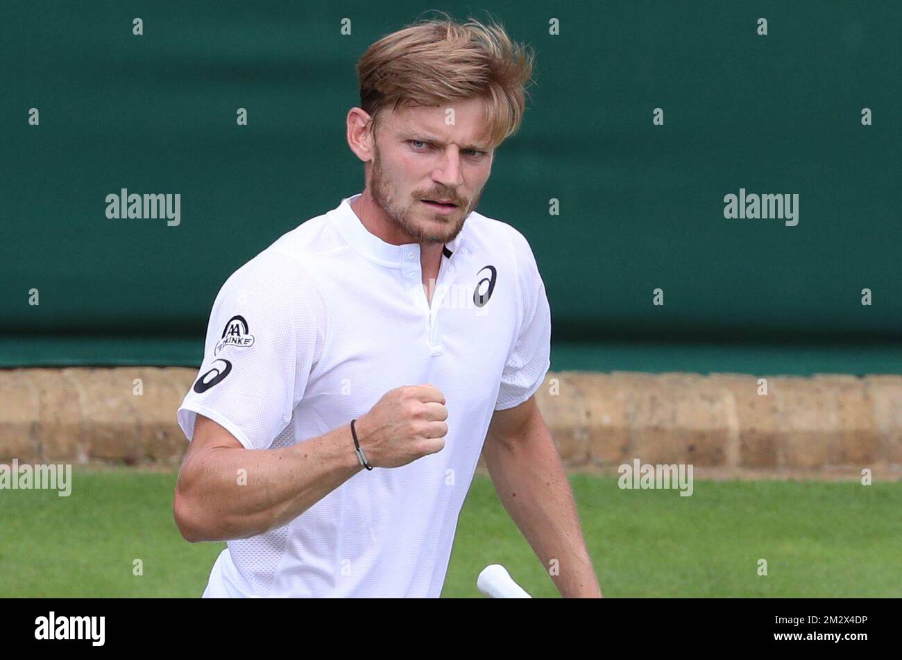 Belgian David Goffin reacts as he wins the first set in the game ...