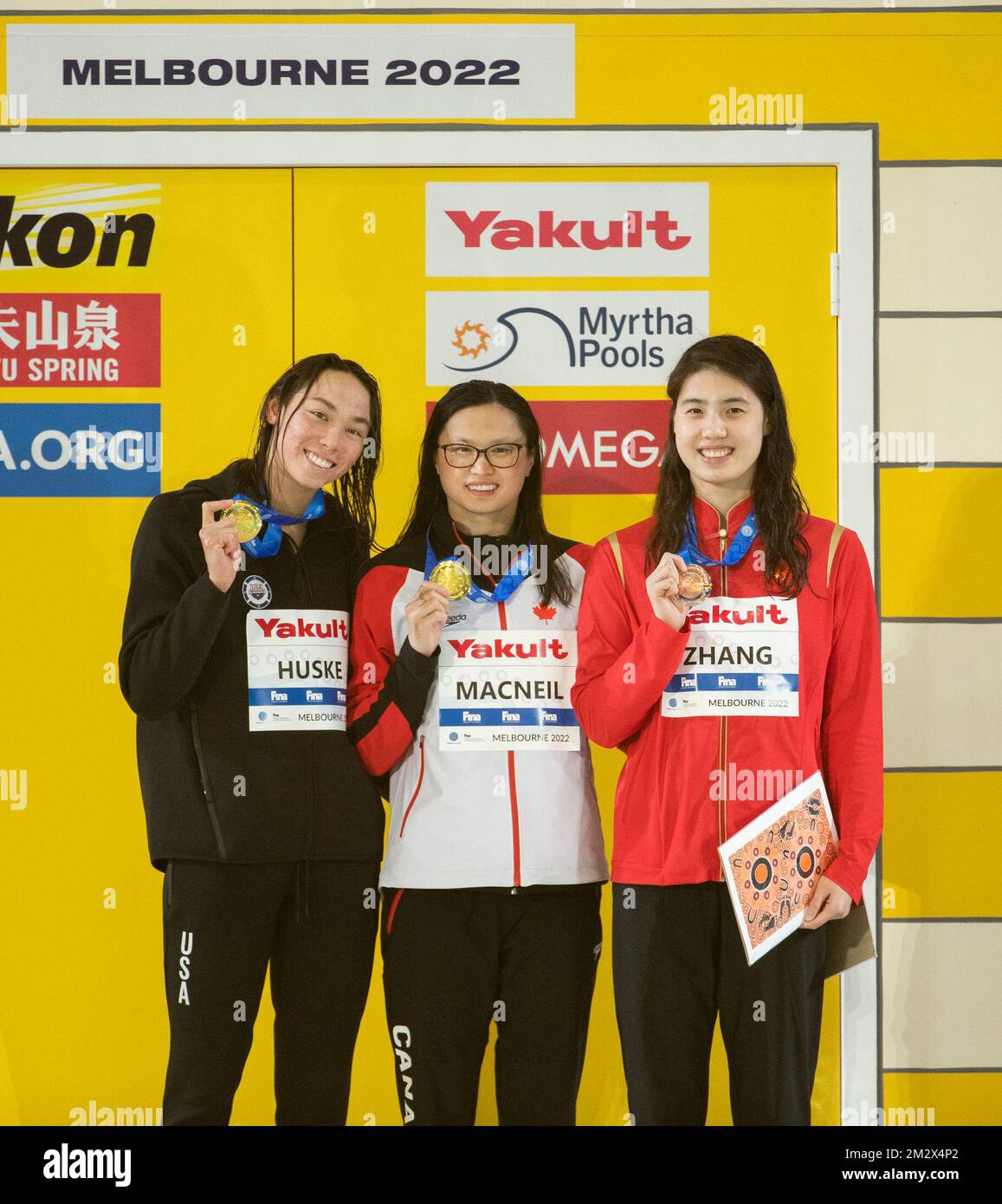 Melbourne, Australia. 14th Dec, 2022. Gold medalists Margaret Macneil (C) of Canada, Torri Huske ...
