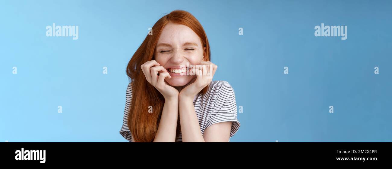 Cheerful carefree giggling ginger girl look happy bright close eyes ...