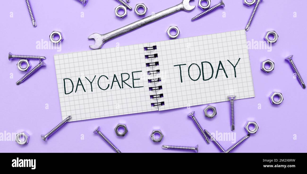 Hand writing sign Daycare. Word for offering care to preschool children ...