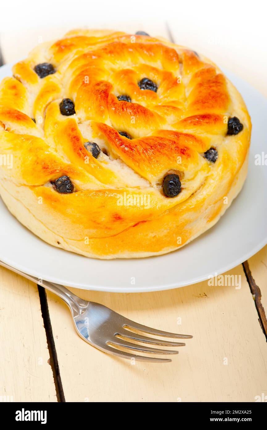 Fresh home baked blueberry bread cake dessert over white wood table ...