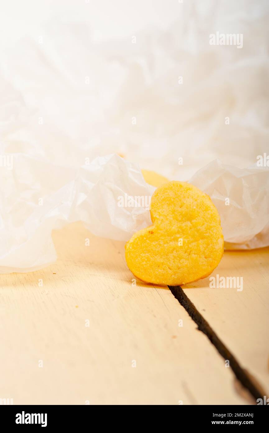 Fresh baked heart shaped shortbread valentine day cookies on a paper ...