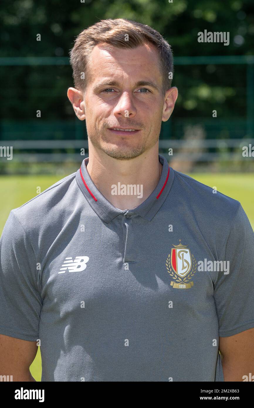 Standard's physical coah Kevin Miny poses for photographer, in marge of ...