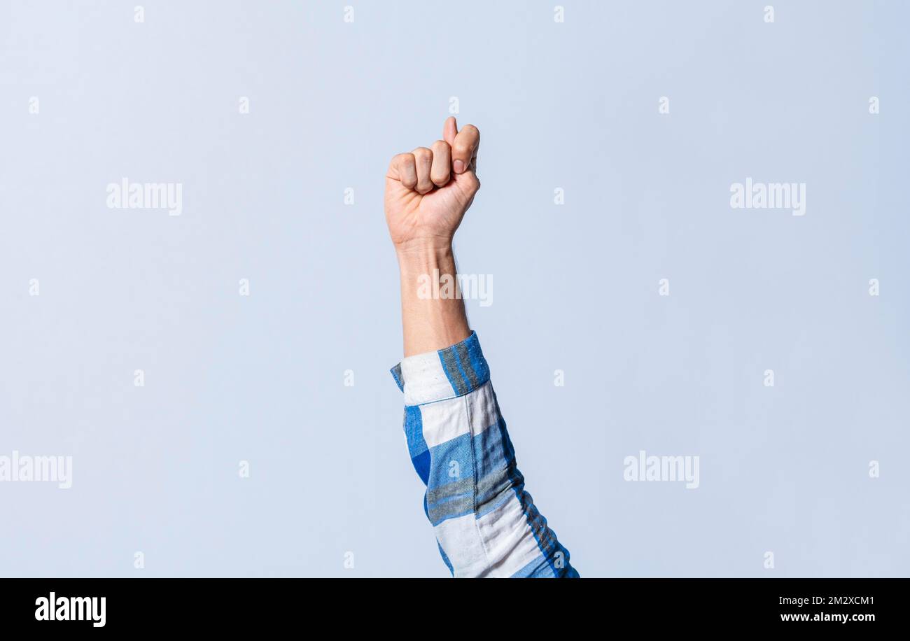 Hand gesturing the letter T in sign language on an isolated background ...