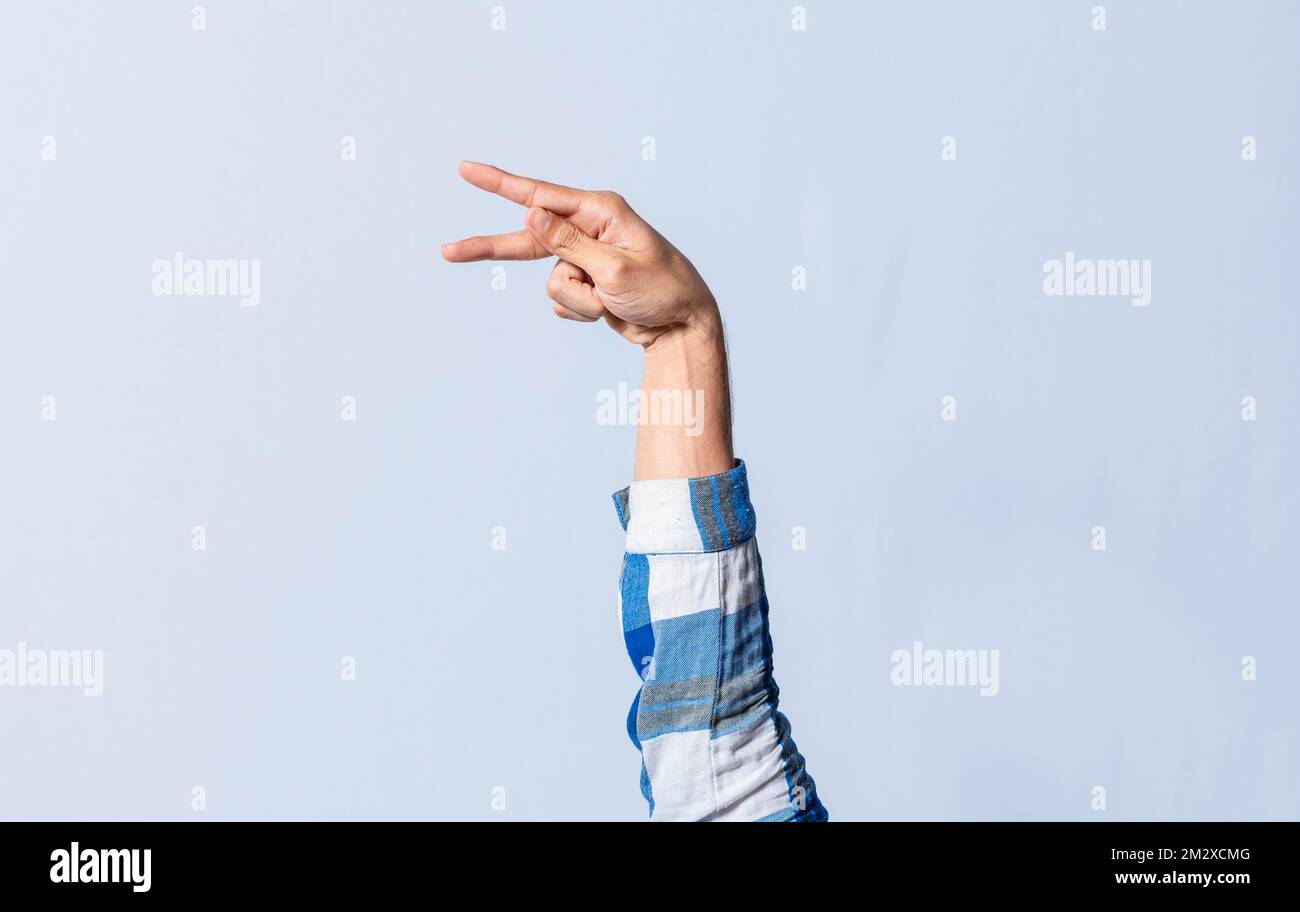 Hand gesturing the letter P in sign language on an isolated background ...