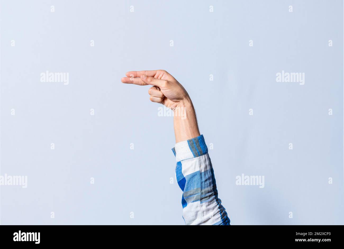 Hand gesturing the letter H in sign language on an isolated background ...