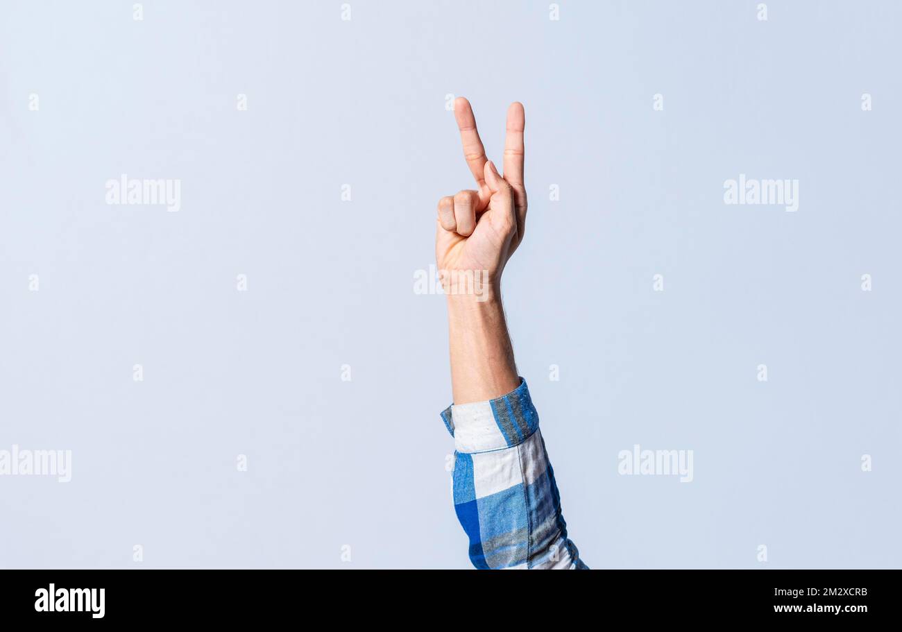 Hand gesturing the letter K in sign language on an isolated background ...