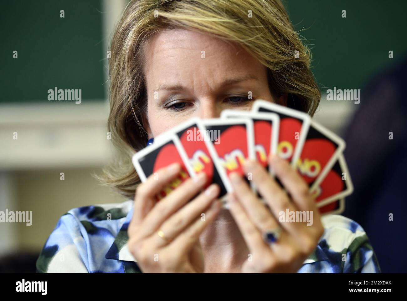 Queen Mathilde of Belgium plays a game of UNO cards during a royal ...