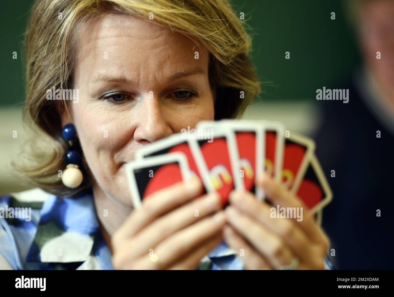 Queen Mathilde of Belgium plays a game of UNO cards during a royal ...