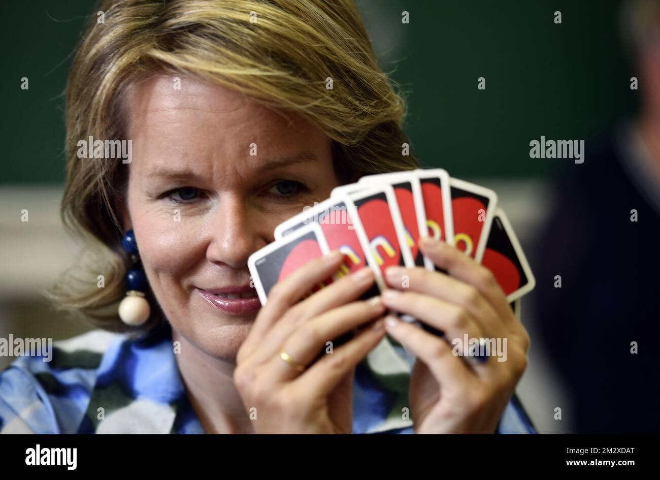 Queen Mathilde of Belgium plays a game of UNO cards during a royal ...