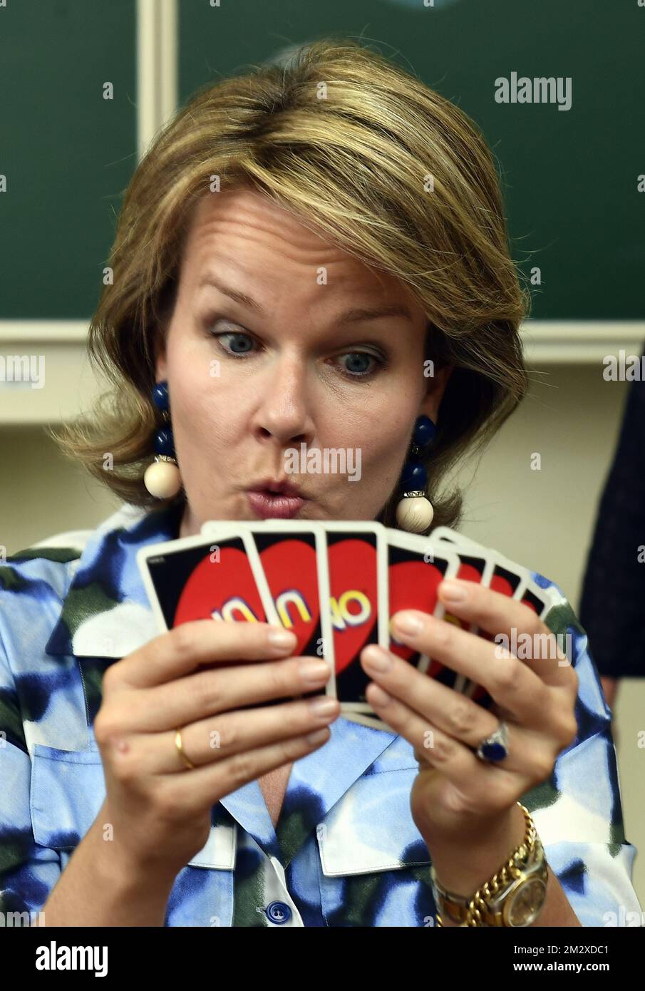 Queen Mathilde of Belgium plays a game of UNO cards during a royal ...