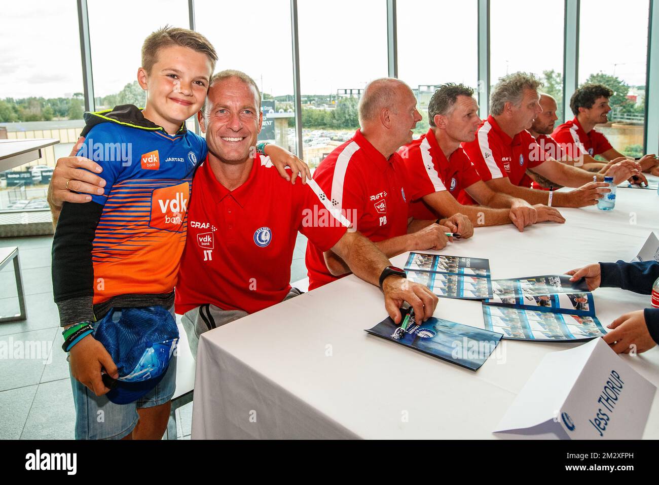 Gent's head coach Jess Thorup poses with a young fan, on the fan day of ...
