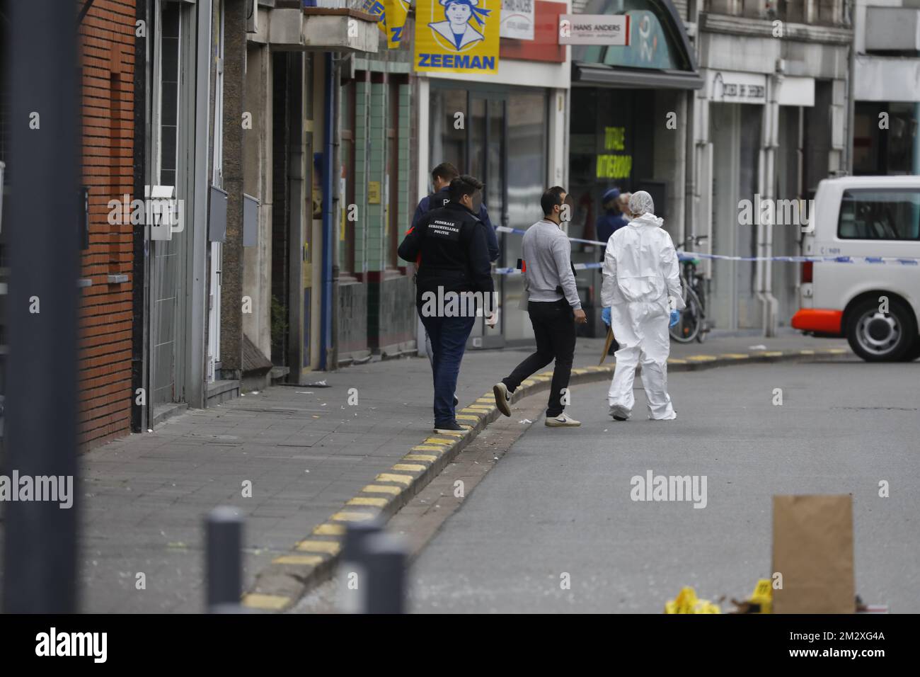 Police investigators pictured at the scene of a shishabar in Willebroek ...