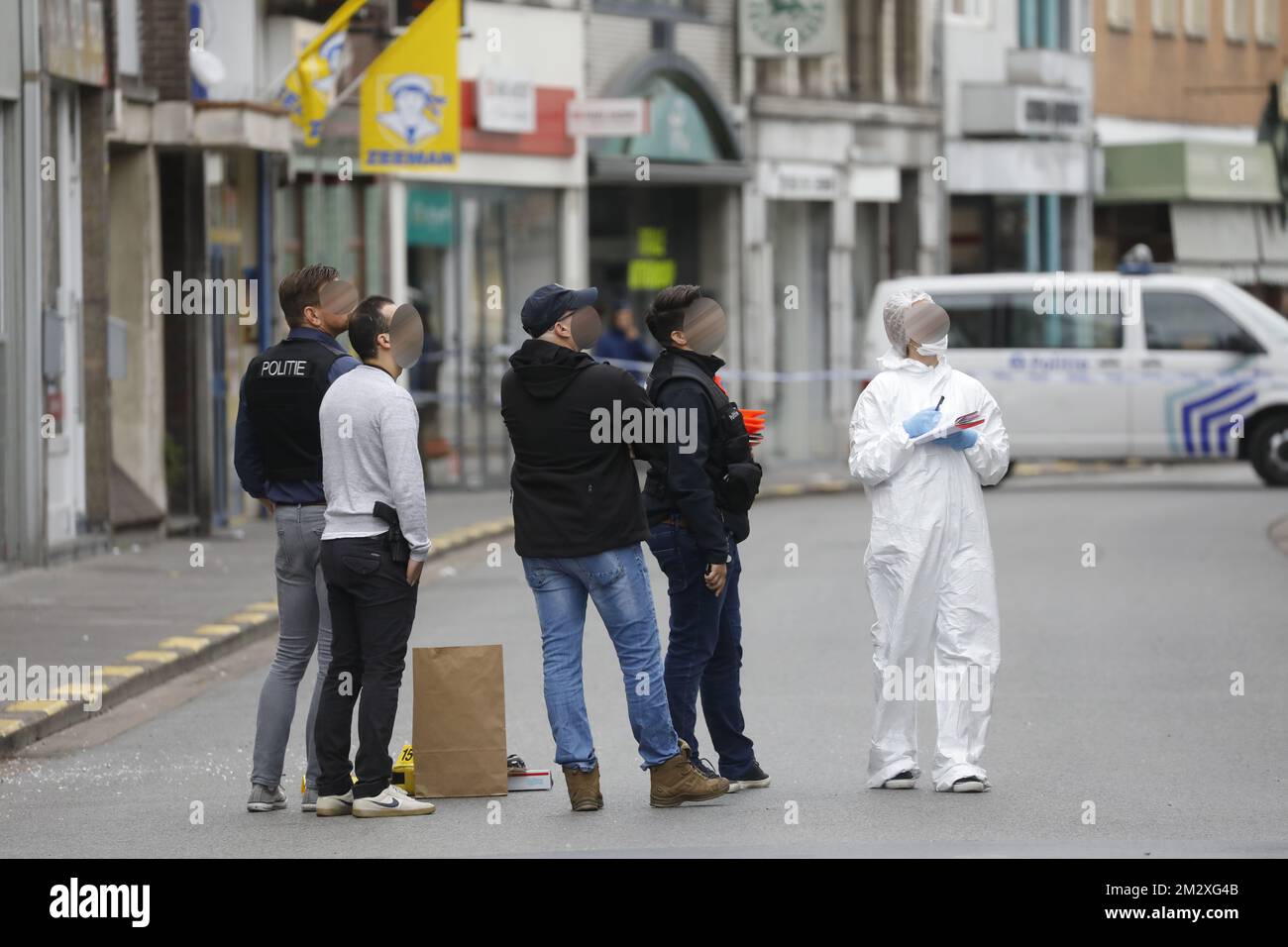 Police investigators pictured at the scene of a shishabar in Willebroek ...