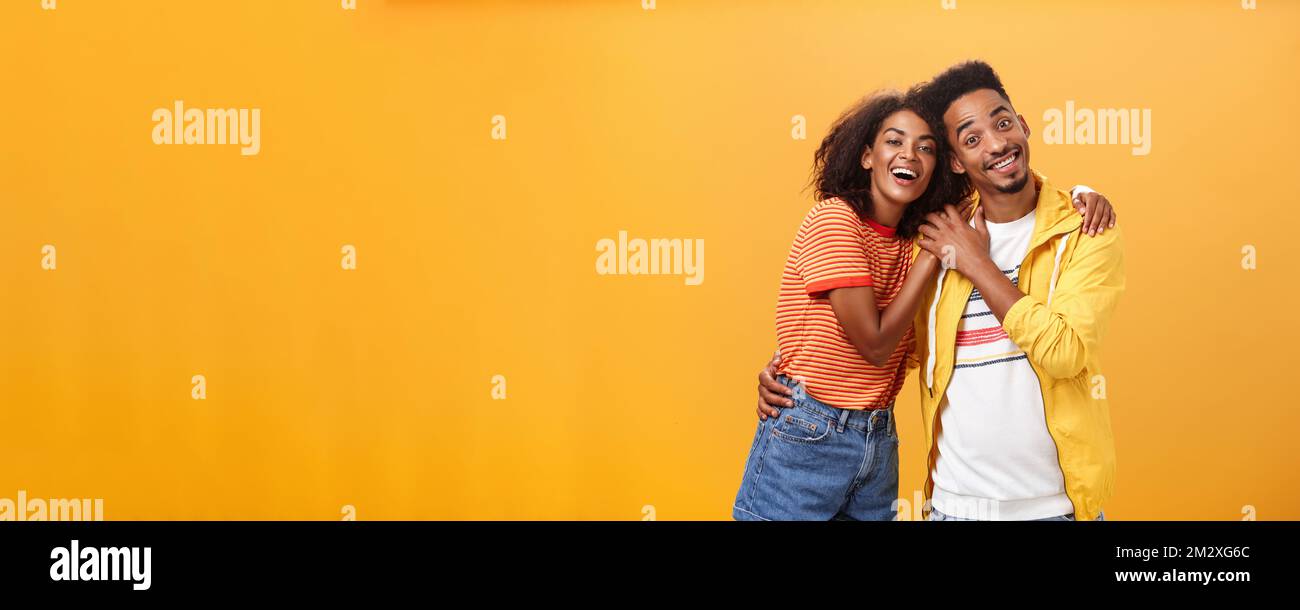 Friends always cover each other. Stylish and carefree loving african ...