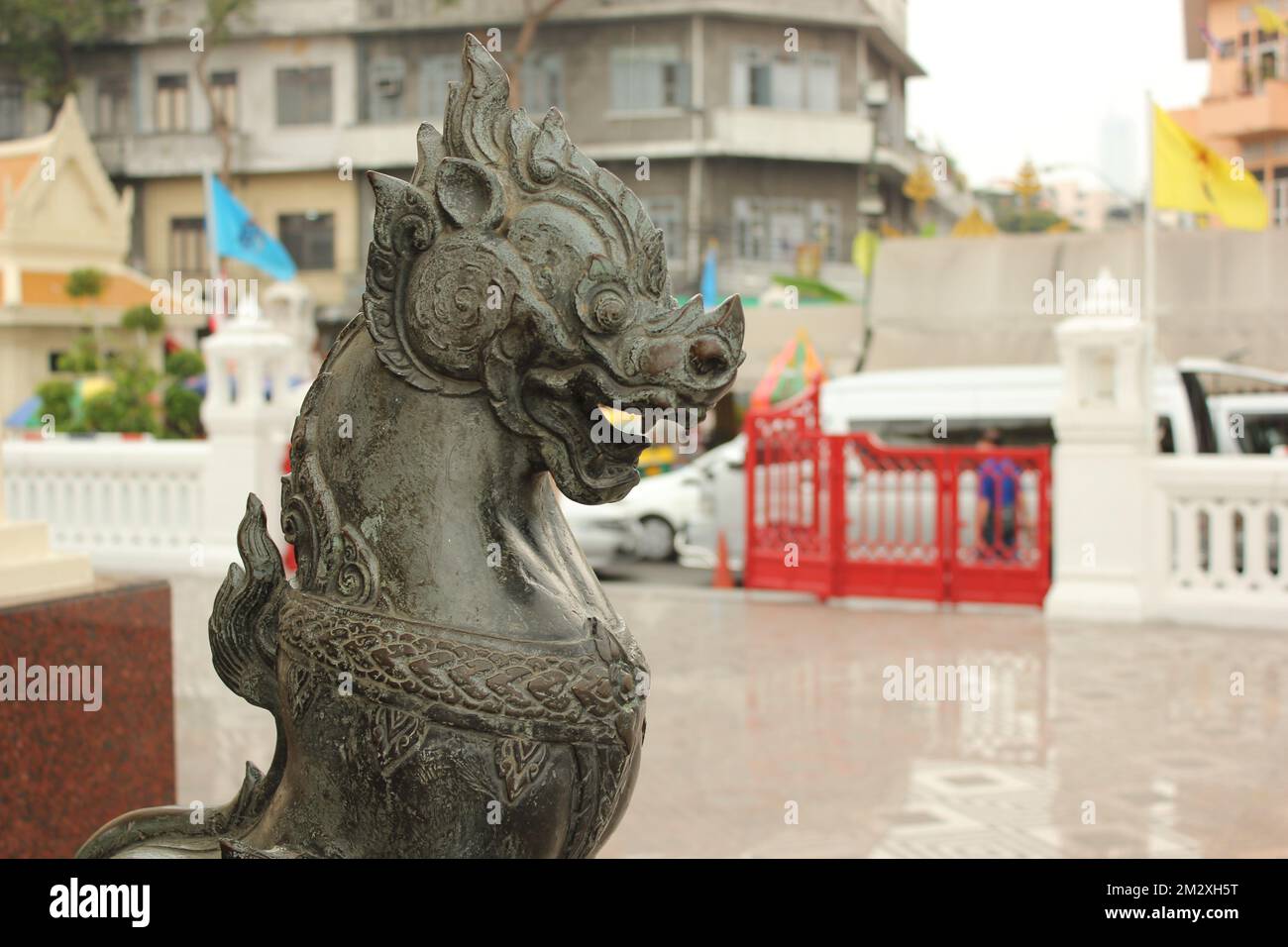 Stone sculpture of protective creature at the entrance of Buddhist ...