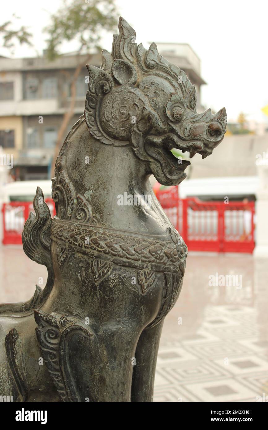 Stone sculpture of protective creature at the entrance of Buddhist ...
