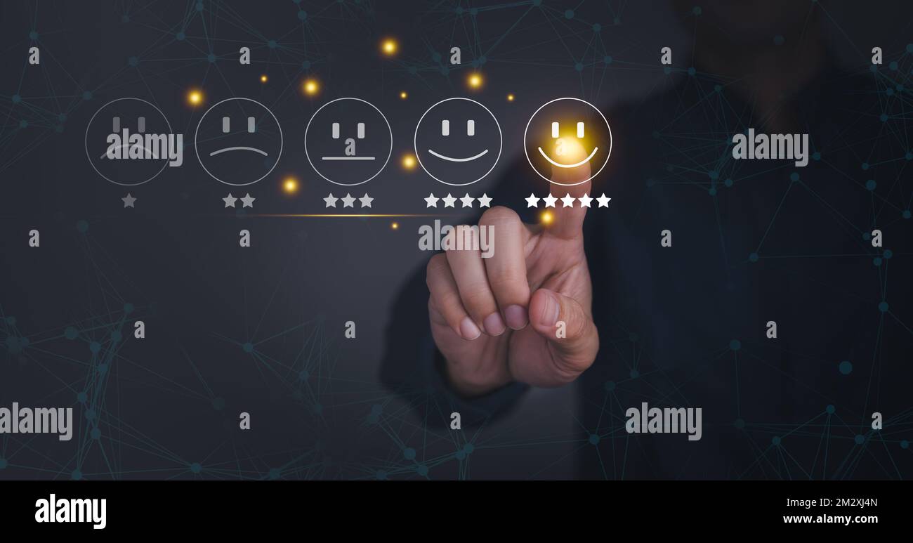 Businessman pressing smiley face emoticon on virtual touch screen ...