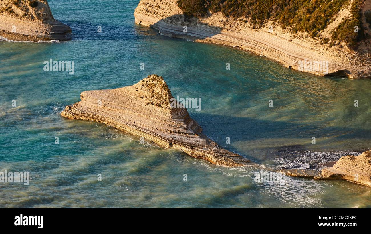 Northwest of the island, Cape Drastis, evening light, sandstone cliffs ...