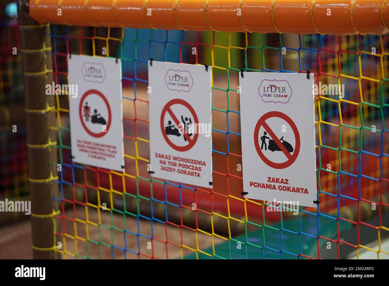A warning signs with symbol with Polish text inside the Lider indoor ...