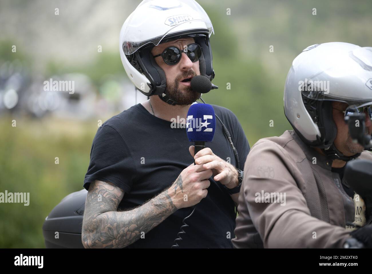 British former cyclist Sir Bradley Wiggins comments the race on a moto ...