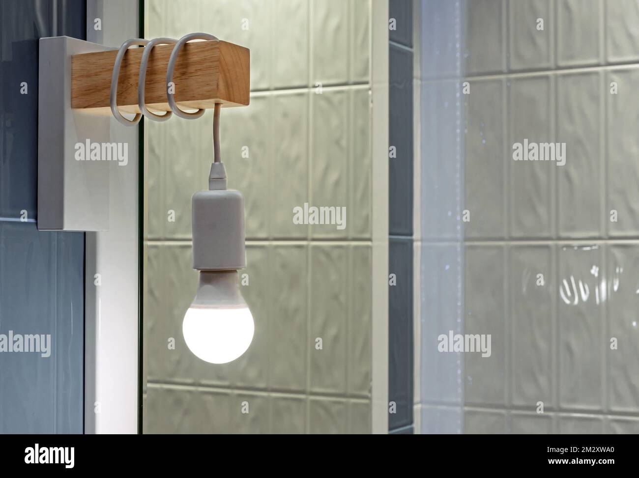 LED lamp with coiled cable in the interior of the bathroom Stock Photo ...