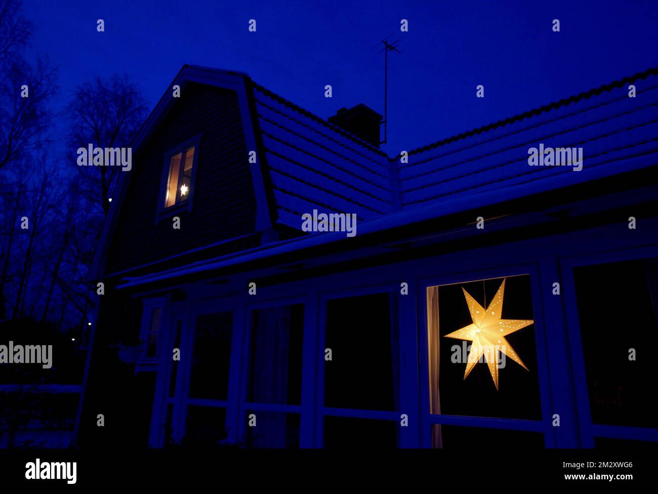 A Christmas star shining in a house Stock Photo - Alamy