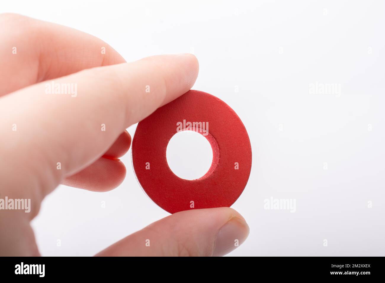 Hand holding letter cube O of made of wood Stock Photo - Alamy