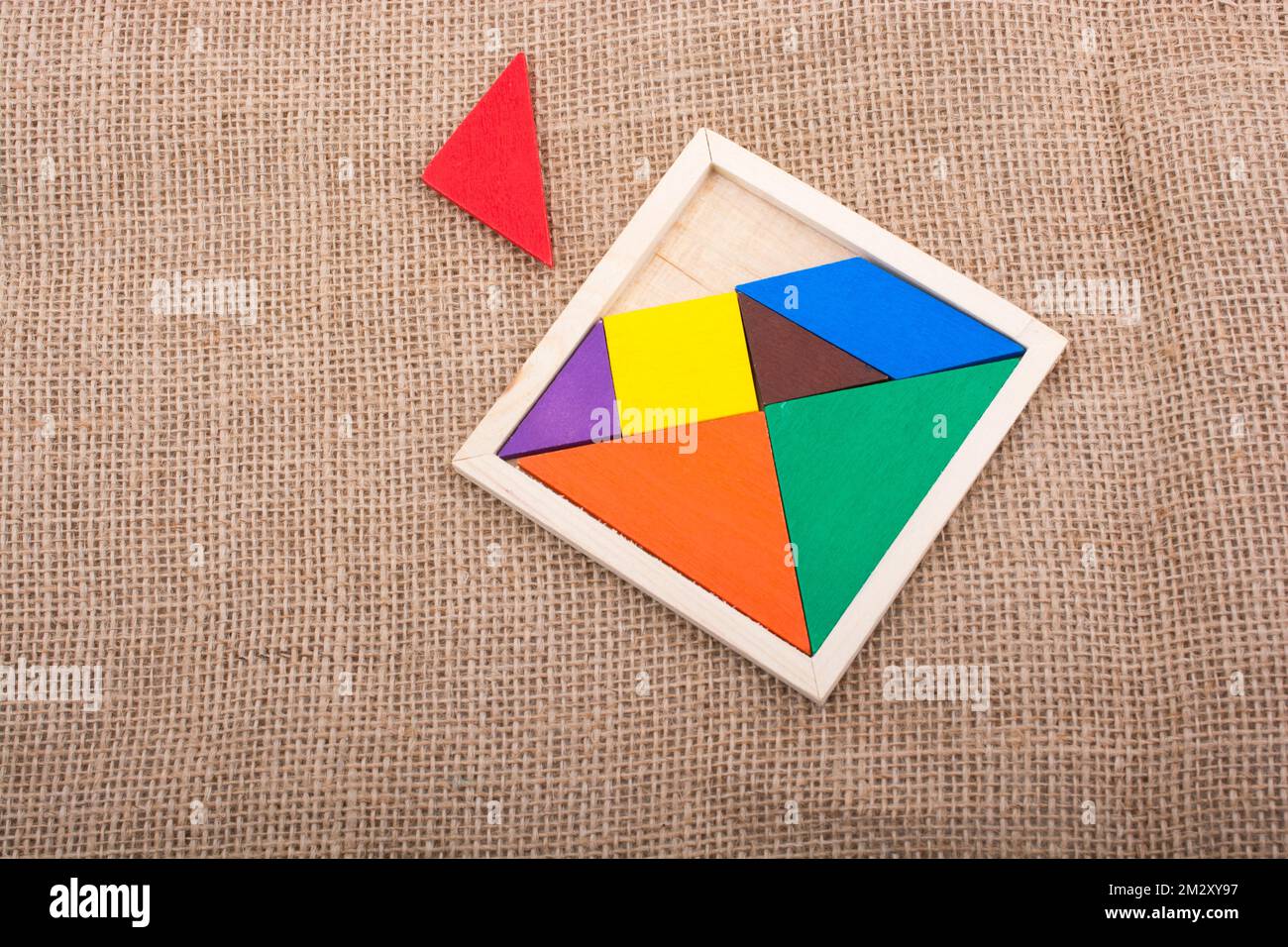 Colorful pieces of a square tangram puzzle Stock Photo - Alamy