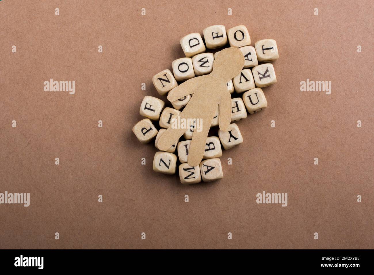 Paper man and letter cubes of made of wood Stock Photo - Alamy