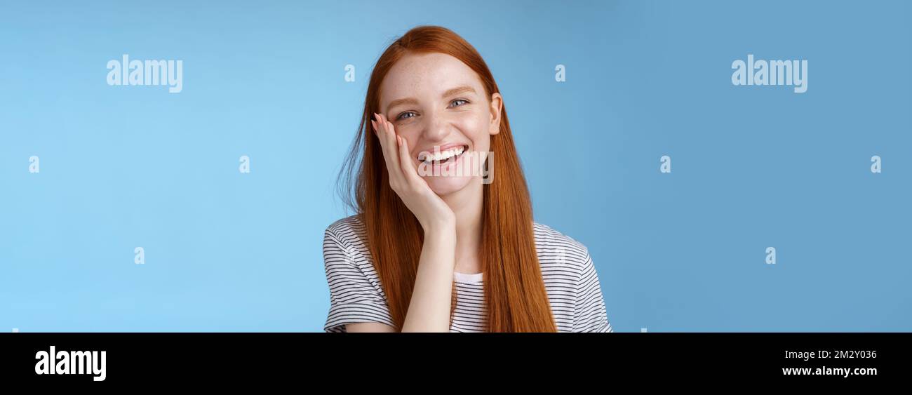 Charismatic talkative friendly-looking happy laughing redhead girl ...