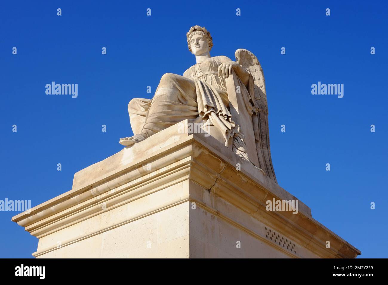 A low-angle shot of the statue of Victorious France as a sitting angel ...