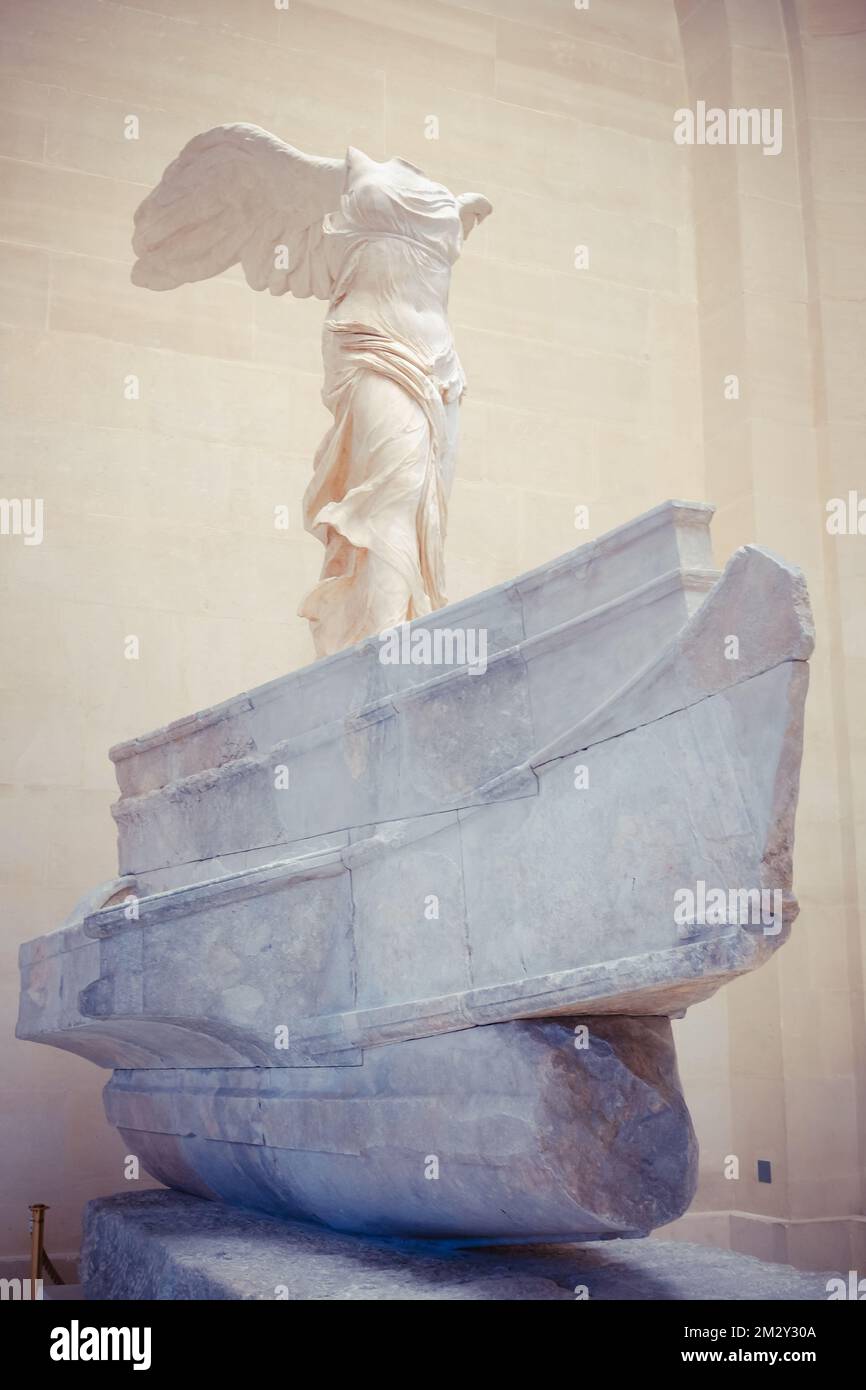 A vertical shot of the Winged Victory of Samothrace. Louvre Museum ...